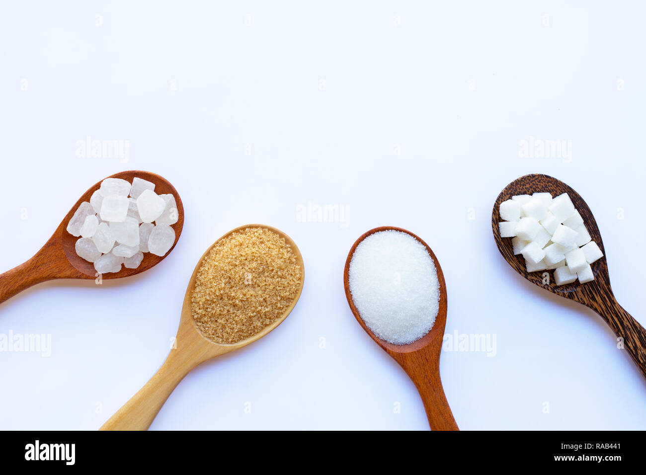 Various types of sugar on white background Stock Photo - Alamy