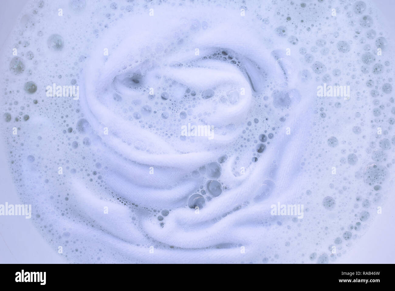 Soak a cloth before washing, white cloth Stock Photo - Alamy