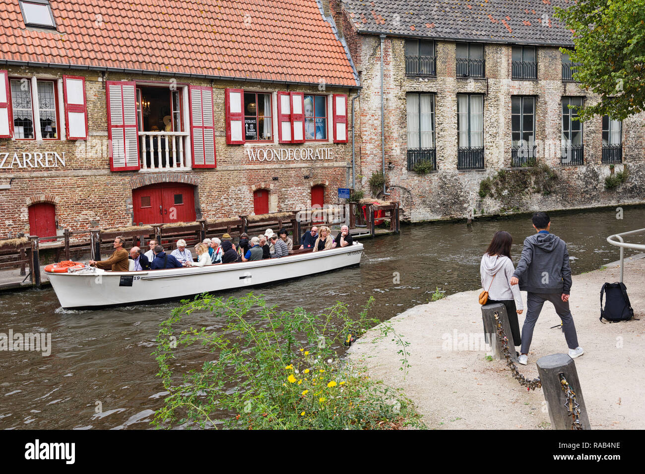 boat ride on the canals in Bruges, Belgium Stock Photo - Alamy