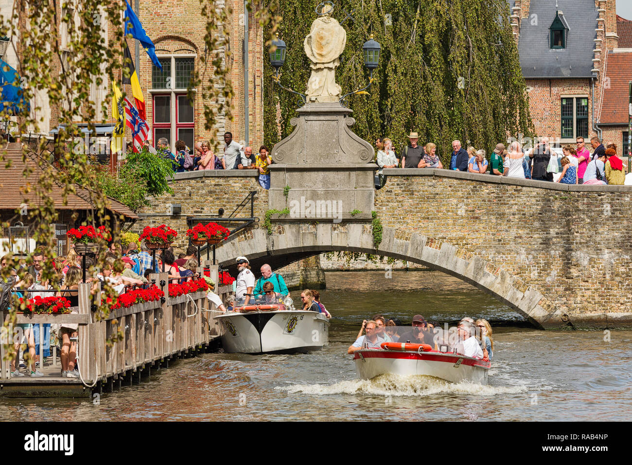 boat ride on the canals in Bruges, Belgium Stock Photo - Alamy