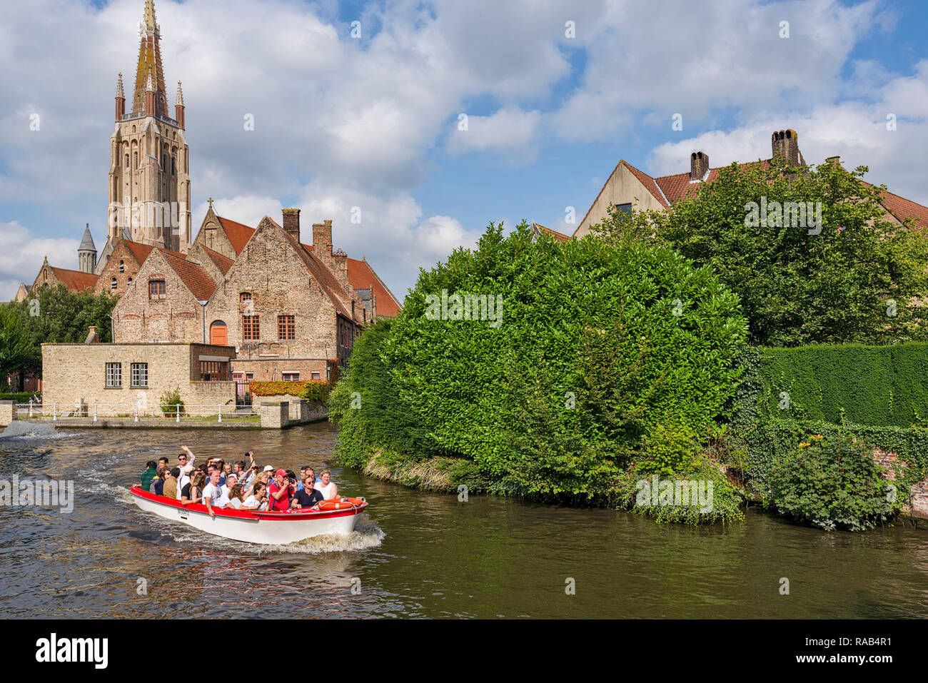 boat ride on the canals in Bruges, Belgium Stock Photo - Alamy