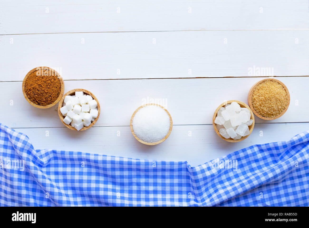 Various types of sugar on white wooden background Stock Photo - Alamy
