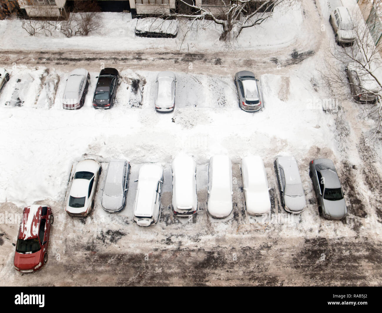 Overhead view of a car parking covered with snow Stock Photo - Alamy