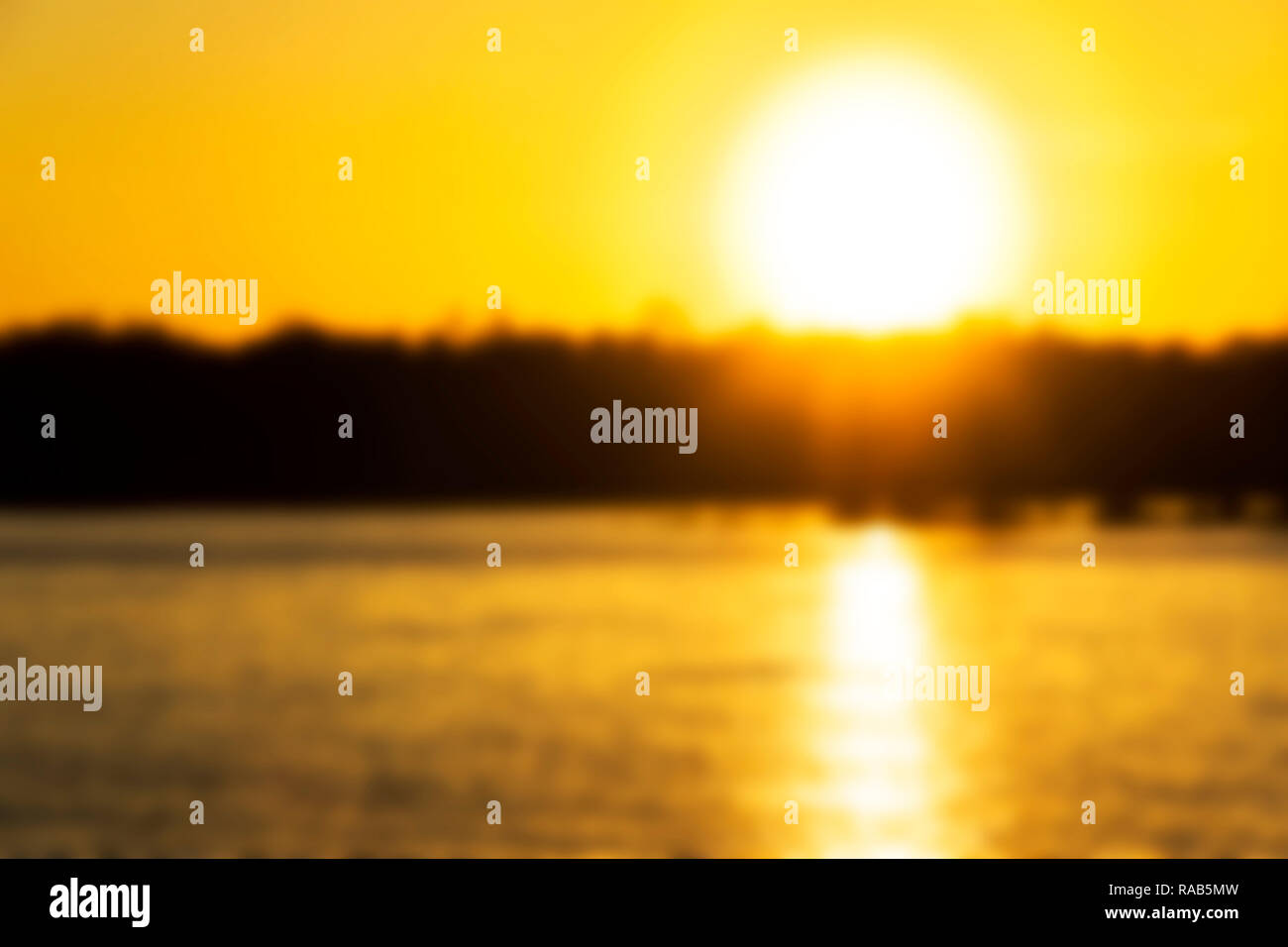 Blurred Summer lake landscape with golden sunrise. River landscape ...