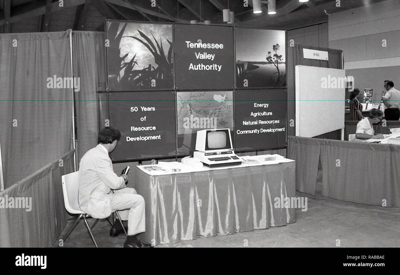 MAN SITTING NEXT TO HIS DISPLAY BOTH AT THE CONVENTION Stock Photo - Alamy