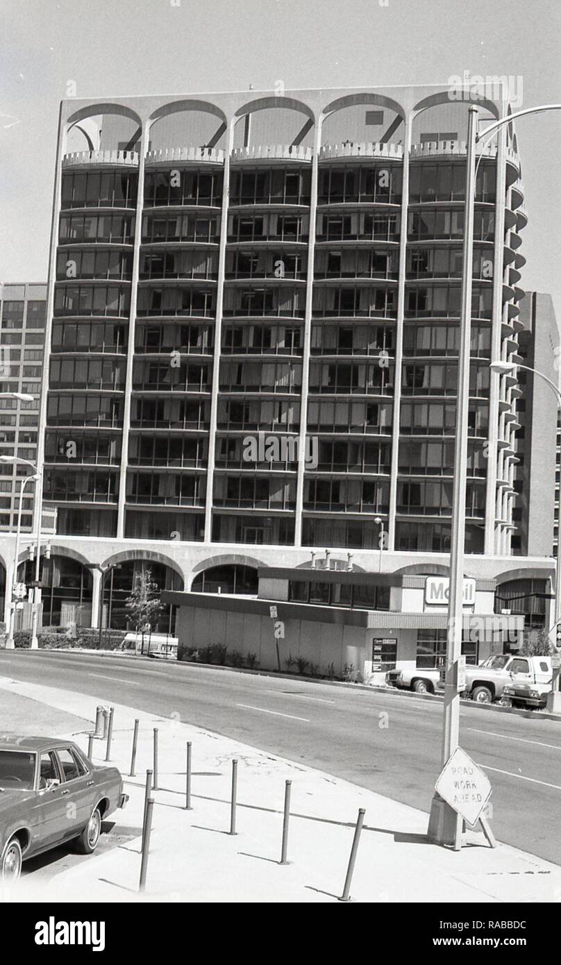 THIS PICTURE SHOWS A TALL BUILDING AND MOBIL GAS STATION IN FRONT OF IT ...