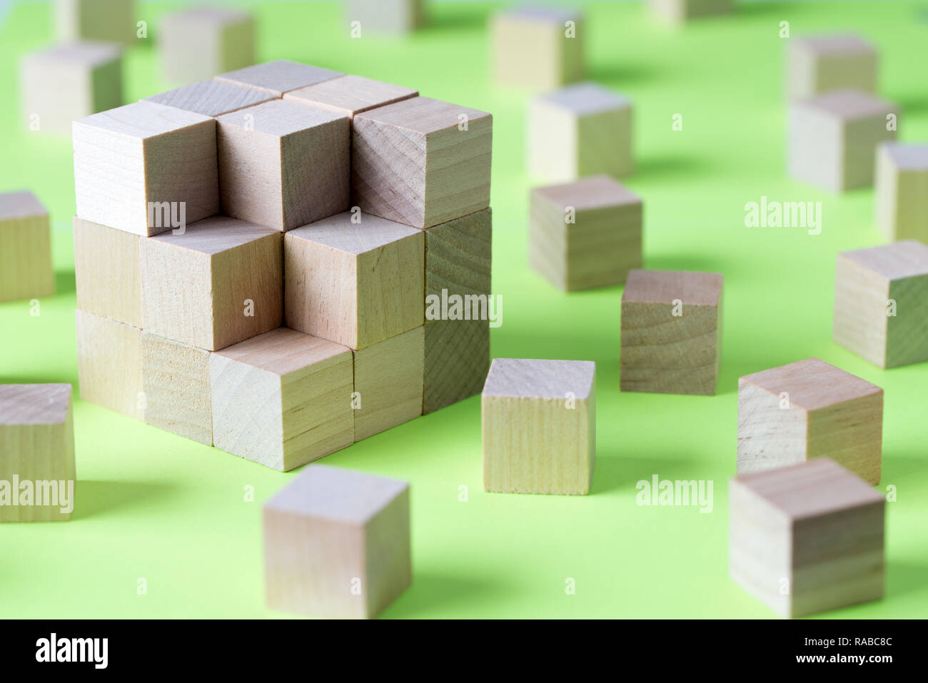 Wooden cubes form a bigger square Stock Photo - Alamy