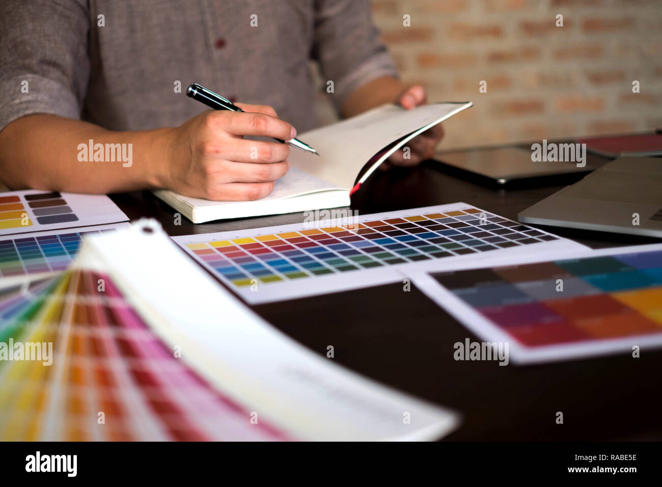 Graphic designers choose colors from the color bands samples for design ...