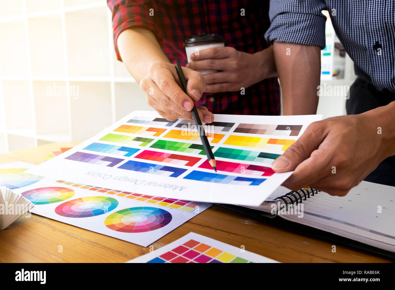 Graphic designers choose colors from the color bands samples for design ...