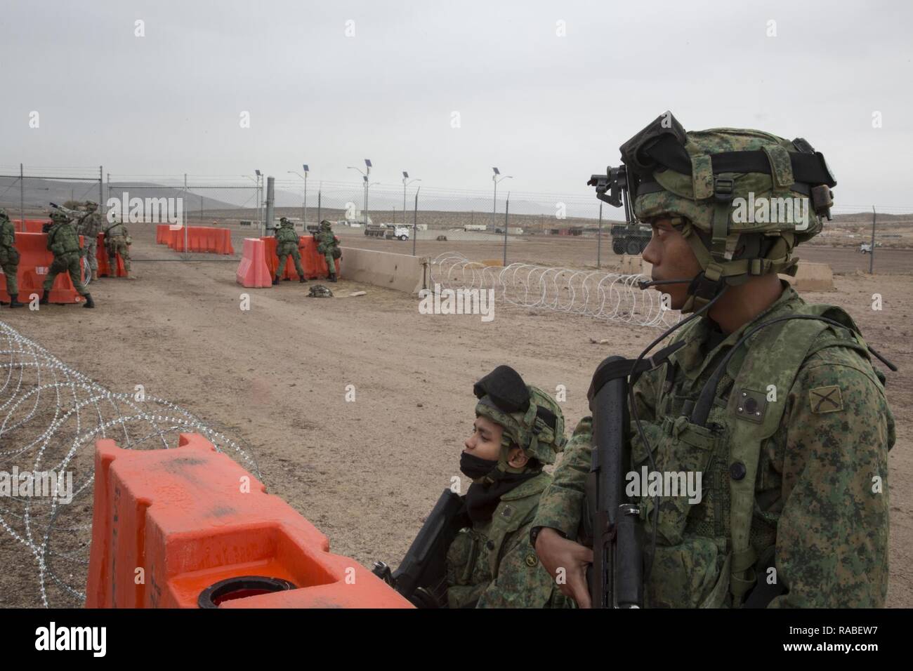 U.S. Army and members of the Singapore Army participate in a simulated ...