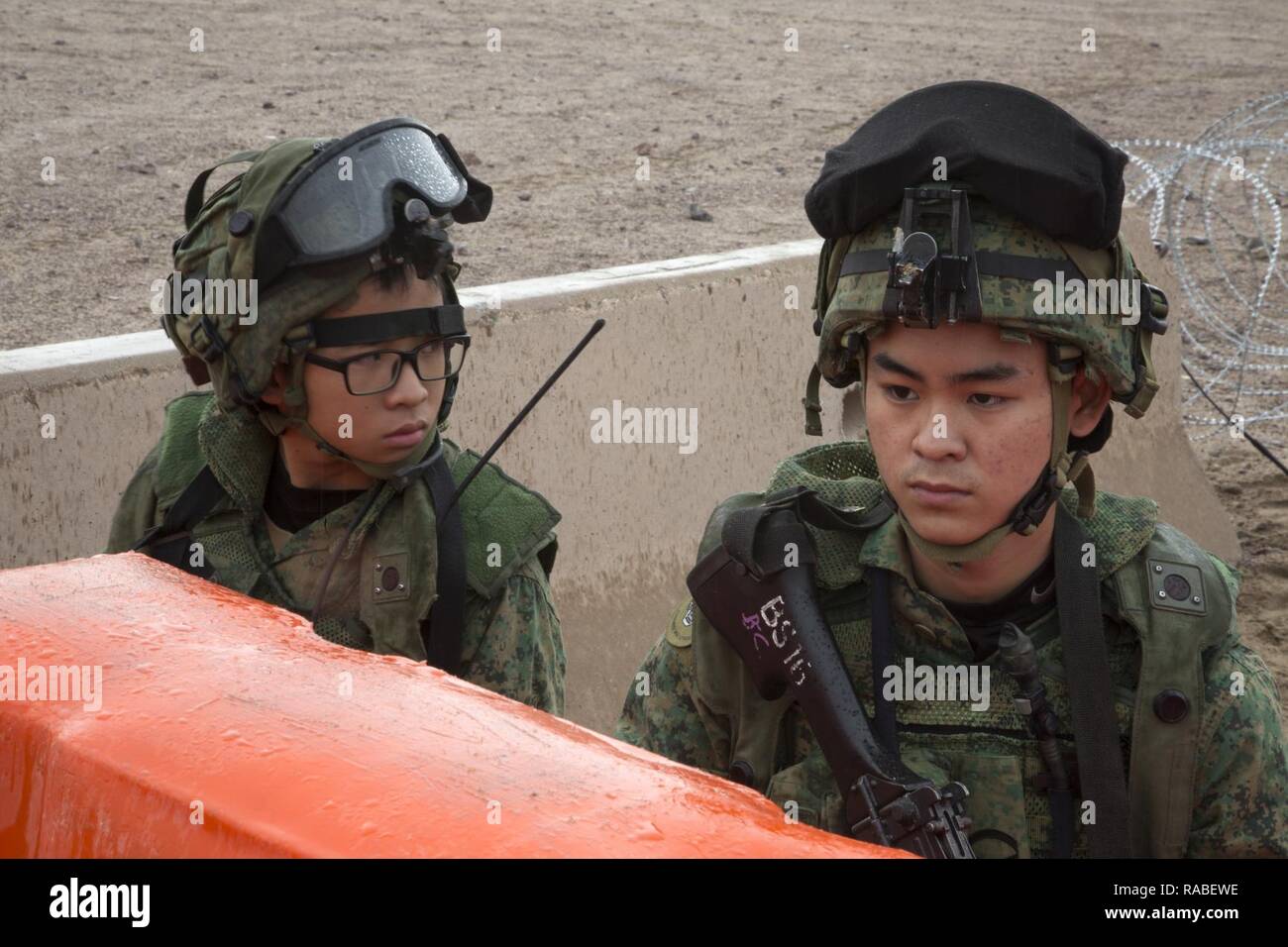 U.S. Army and members of the Singapore Army participate in a simulated ...