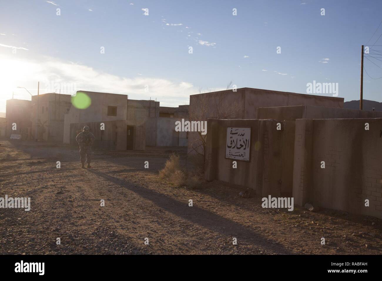 A U.S. Army Soldier patrols the streets of a mock combat zone at the ...