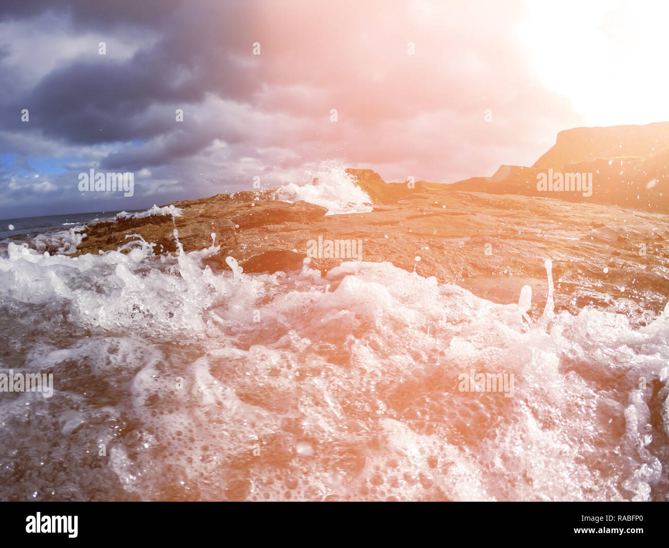 Blue Ocean Wave Crashing the coastline at sunrise Stock Photo - Alamy