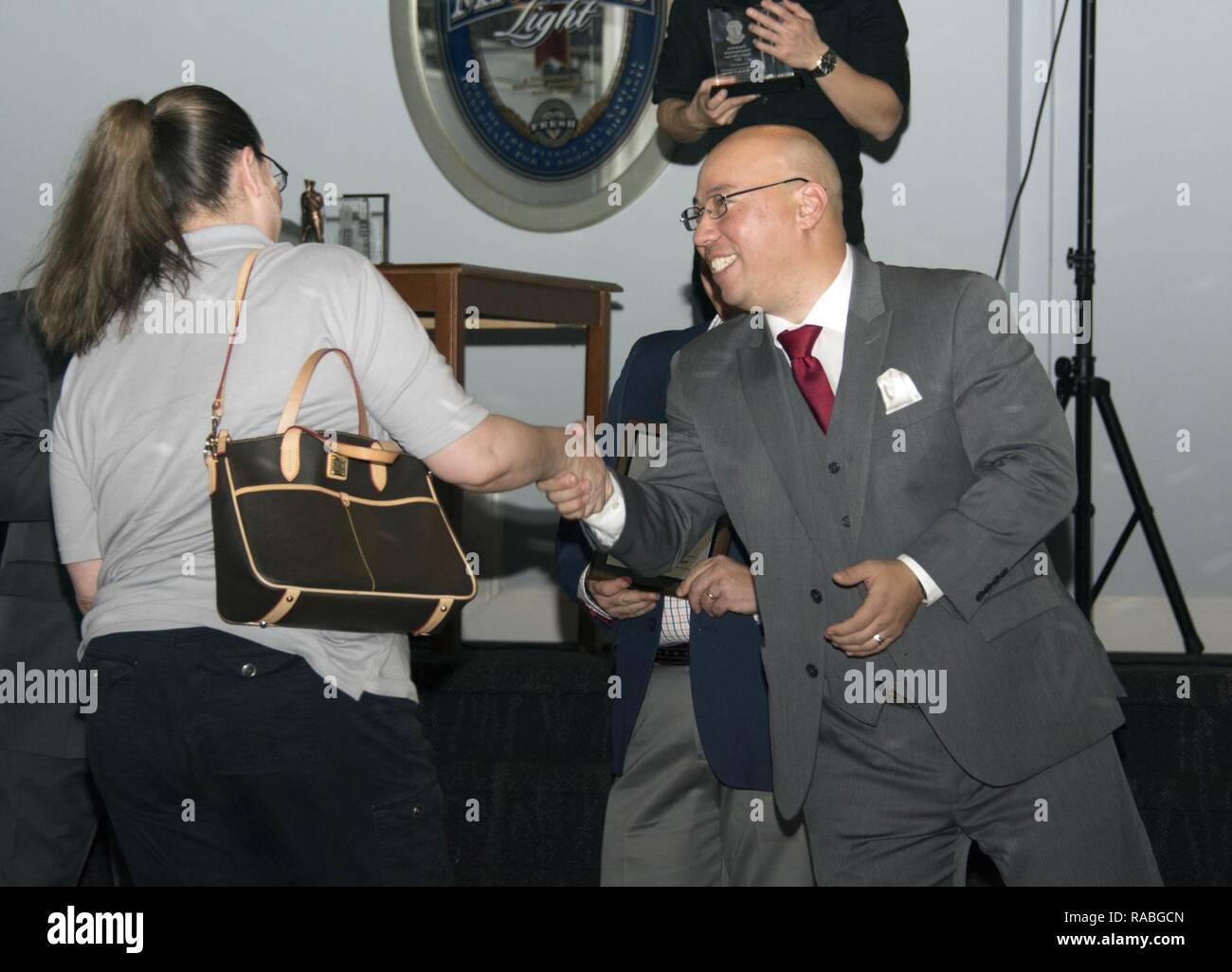 Fort Jackson Police Department Chief Ruben Santiago congratulates Ms ...