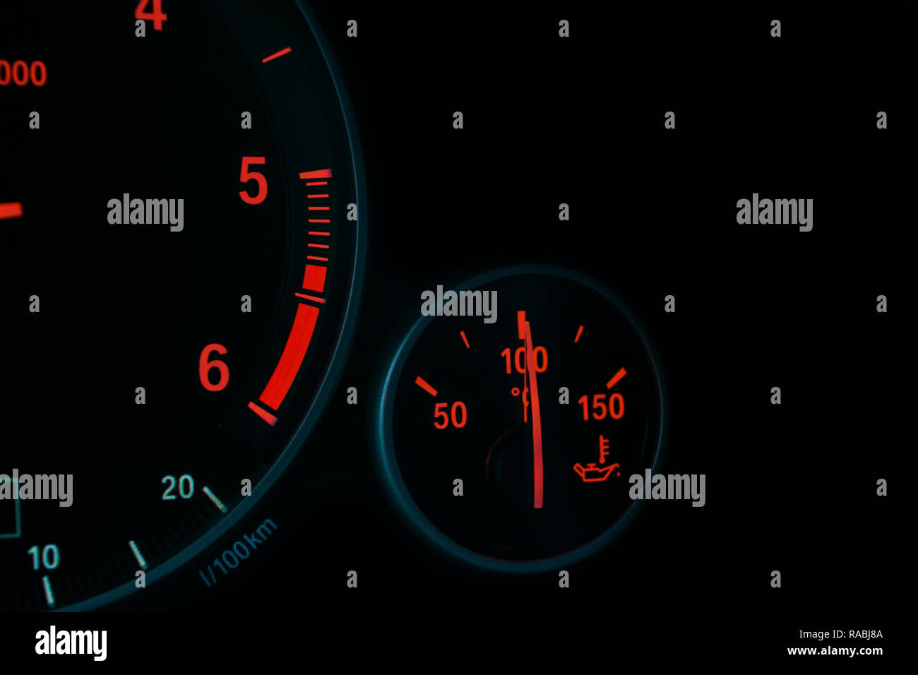 Coolant temperature gauge and tahometer on a car's dashboard. Modern ...