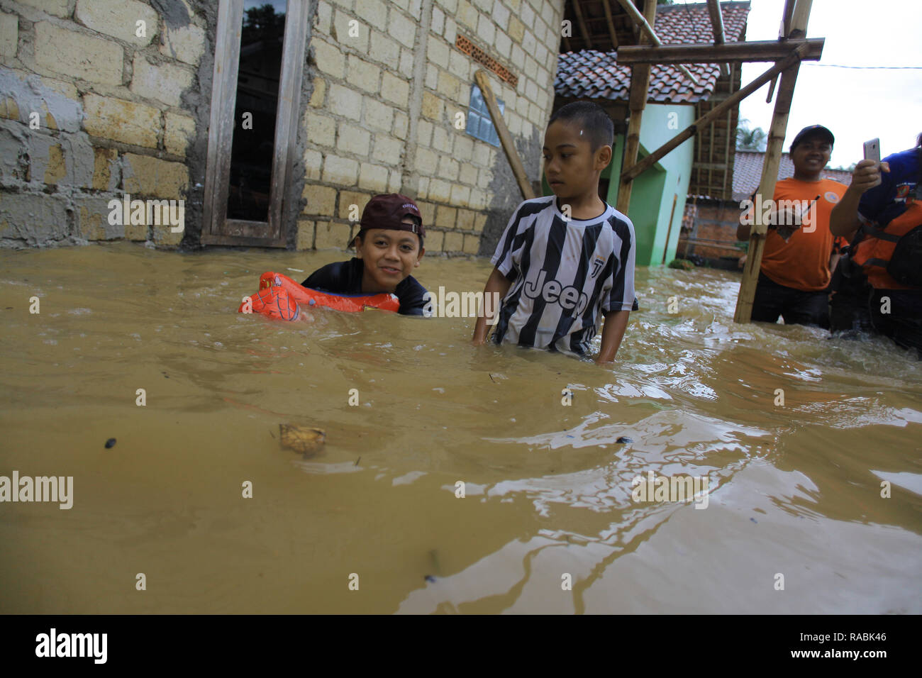 Children playing in flood water hi-res stock photography and images - Alamy