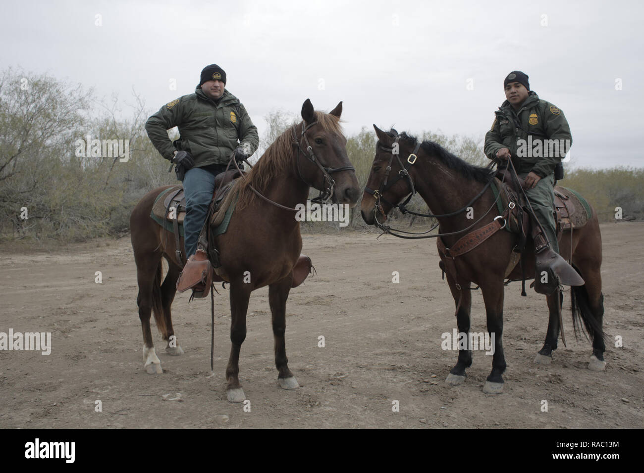 Border Patrol agents ride horses near La Grulla, Texas on January 17 ...