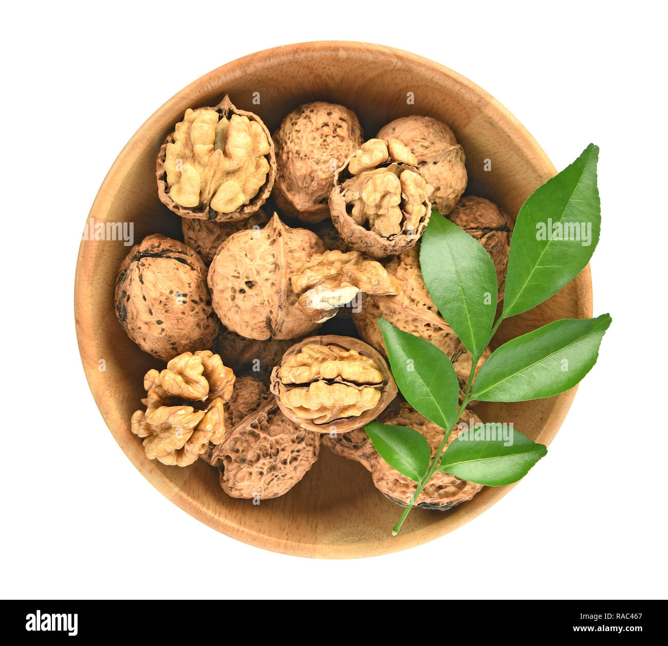 Top view of Walnuts kernels in wooden bowl on white background Stock ...