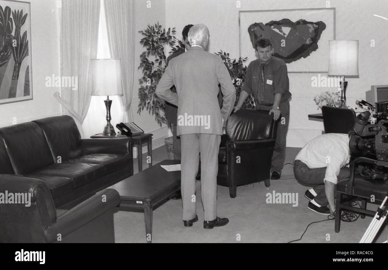 MAN STANDING BEHIND A CHAIR Stock Photo - Alamy