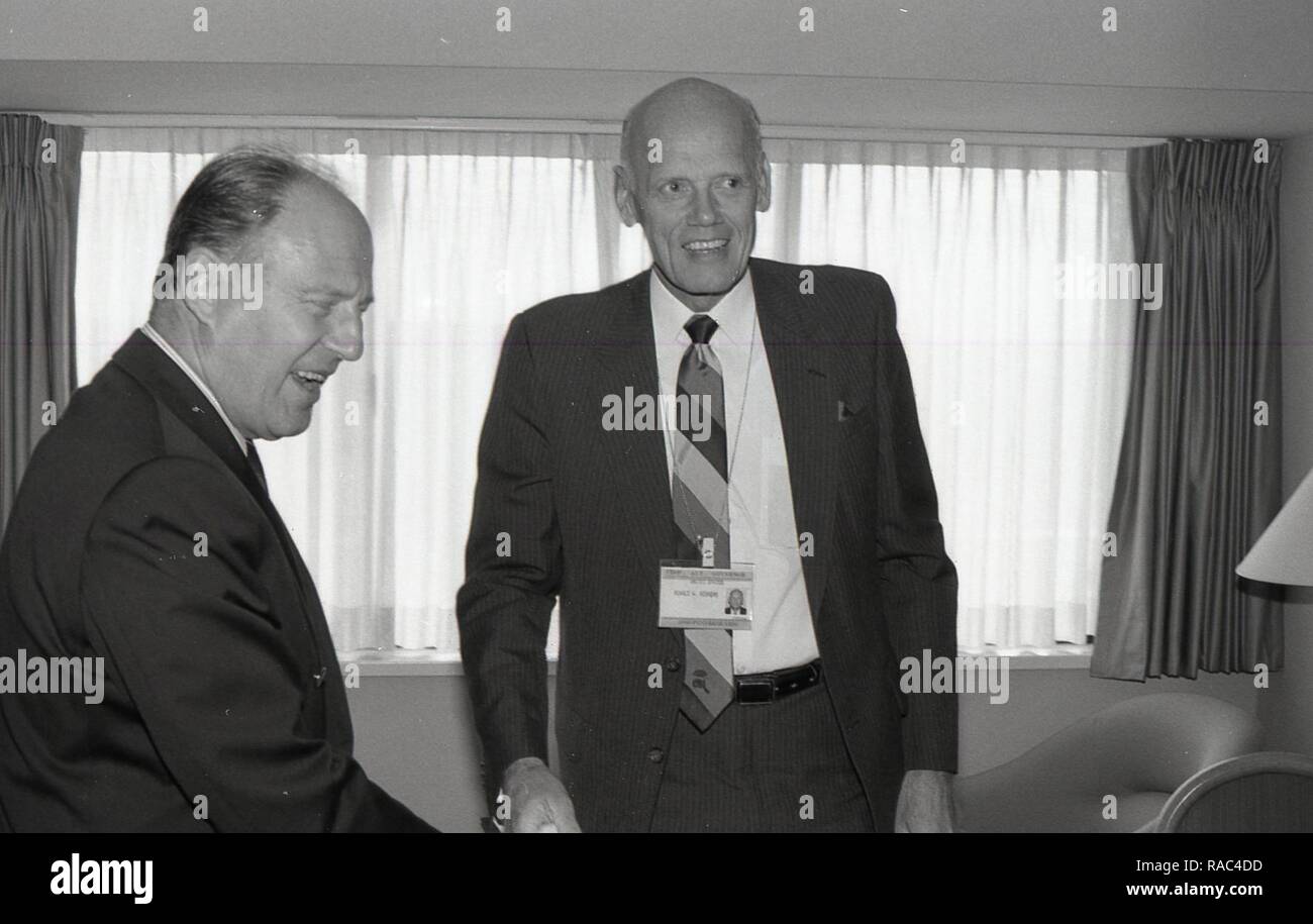 TWO MEN GREETING EACH OTHER AT A MEETING Stock Photo - Alamy