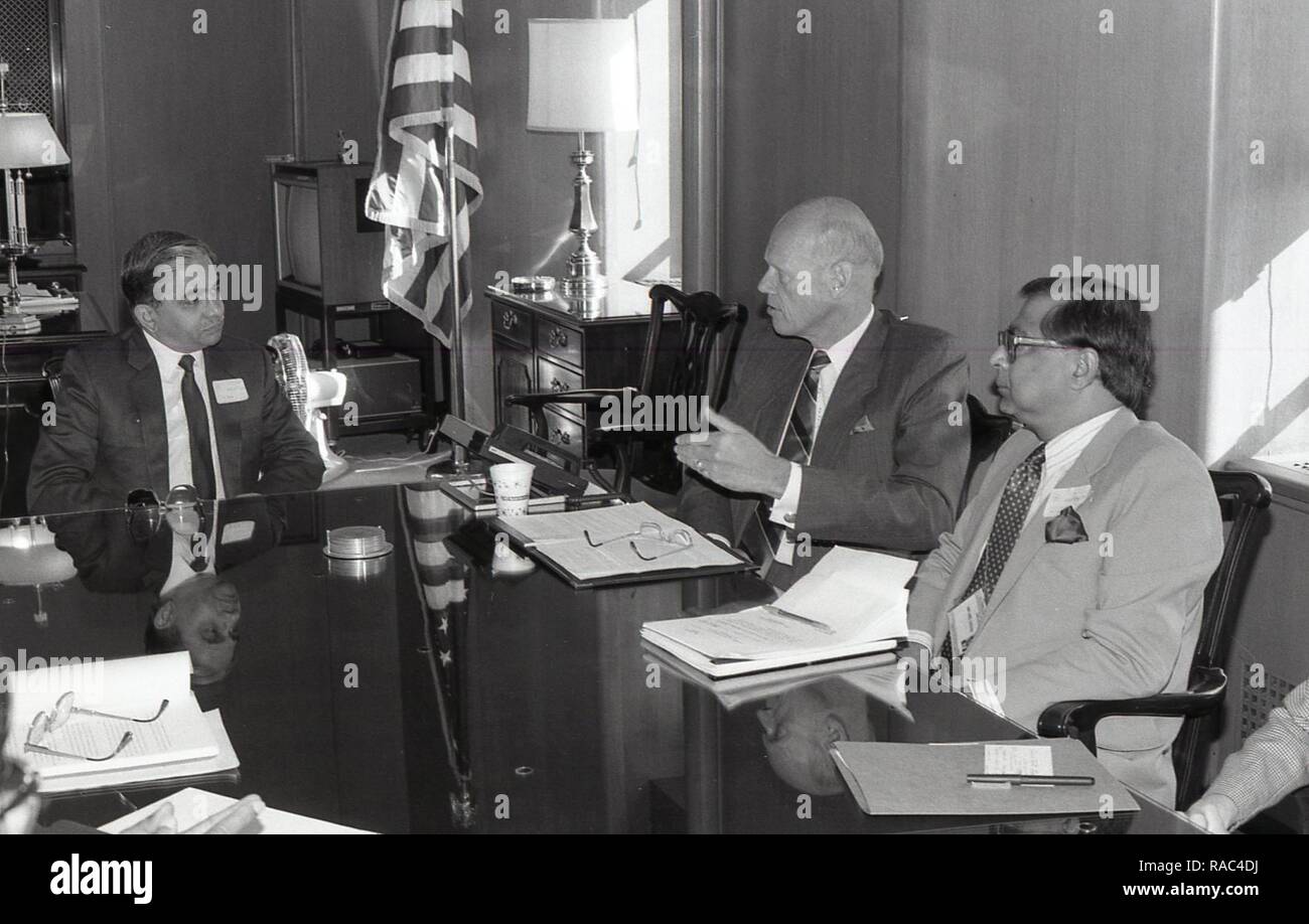 THREE MEN HAVING A CONVERSATION IN A MEETING Stock Photo - Alamy