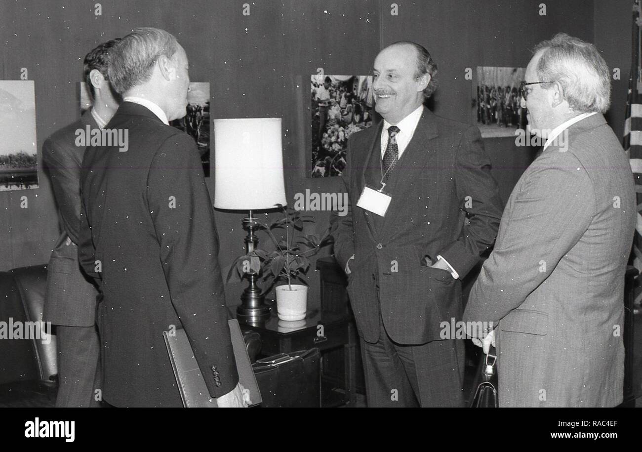 A GROUP OF MEN ARE HAVING A CONVERSATION AT A MEETING Stock Photo - Alamy