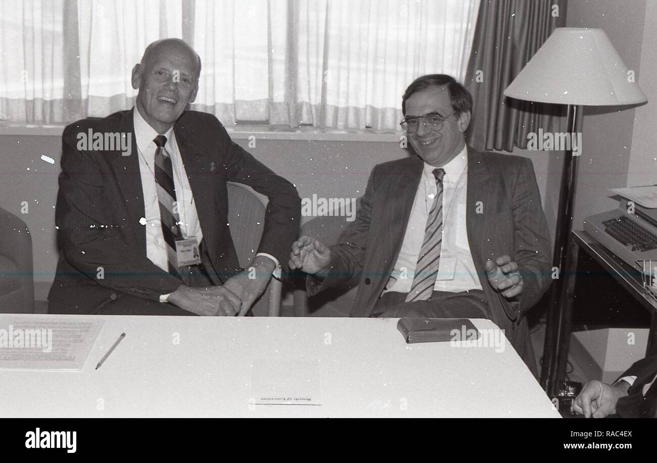 TWO MEN ARE HAVING A CONVERSATION IN THE MEETING Stock Photo - Alamy