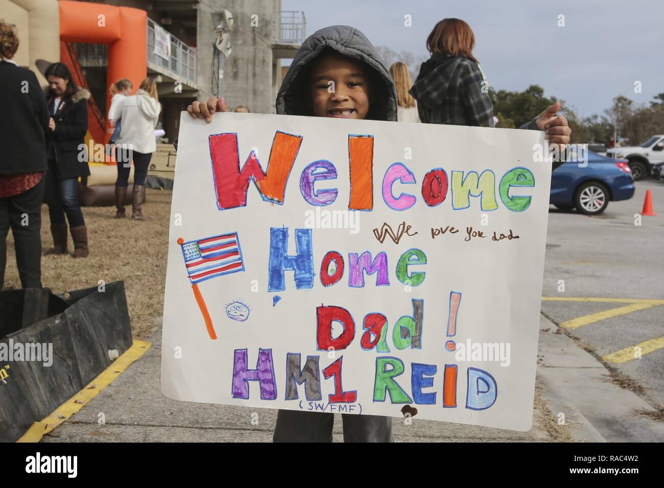 Son of PO1 Scott Reid shows off the sign him and his brother made for ...