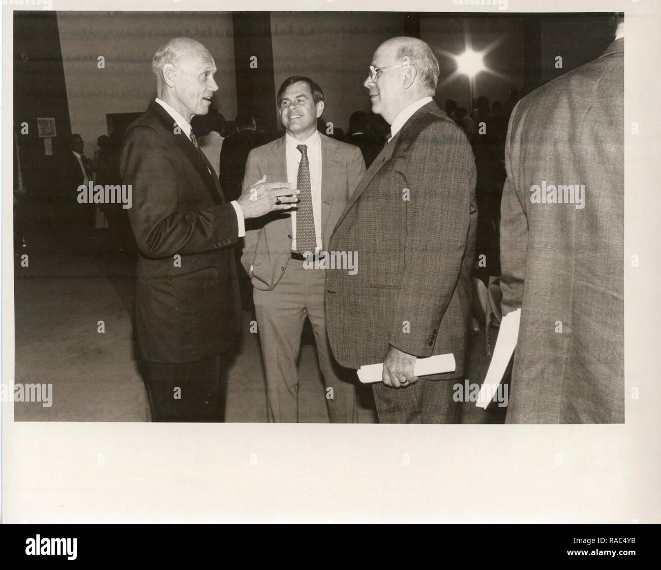 THREE MEN ARE HAVING A CONVERSATION Stock Photo - Alamy