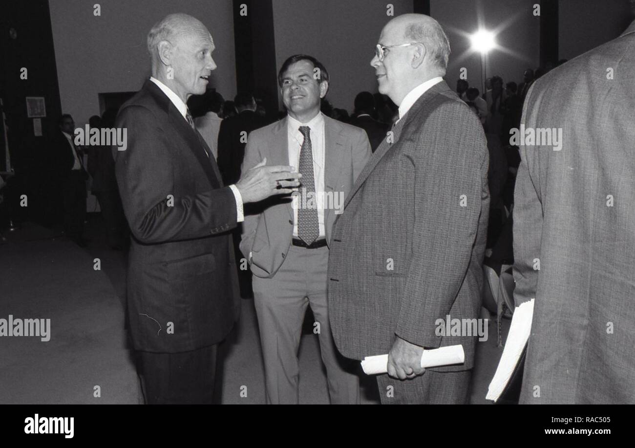 THREE MEN ARE HAVING A CONVERSATION Stock Photo - Alamy