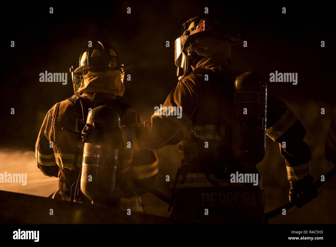 Firefighters fighting fire arff training hi-res stock photography and ...
