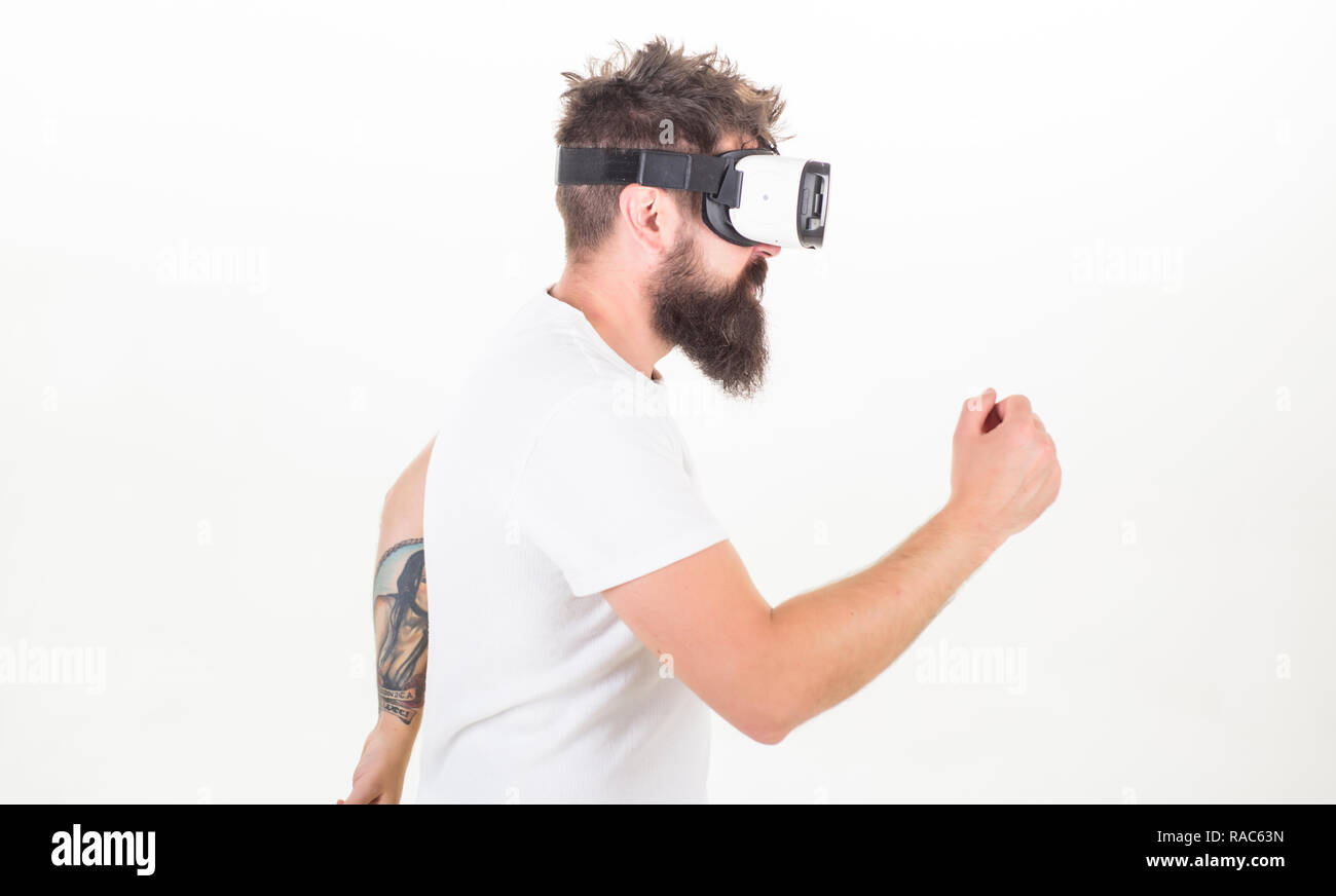Virtual race. Hipster play virtual sport game. Man bearded gamer VR glasses white background ...