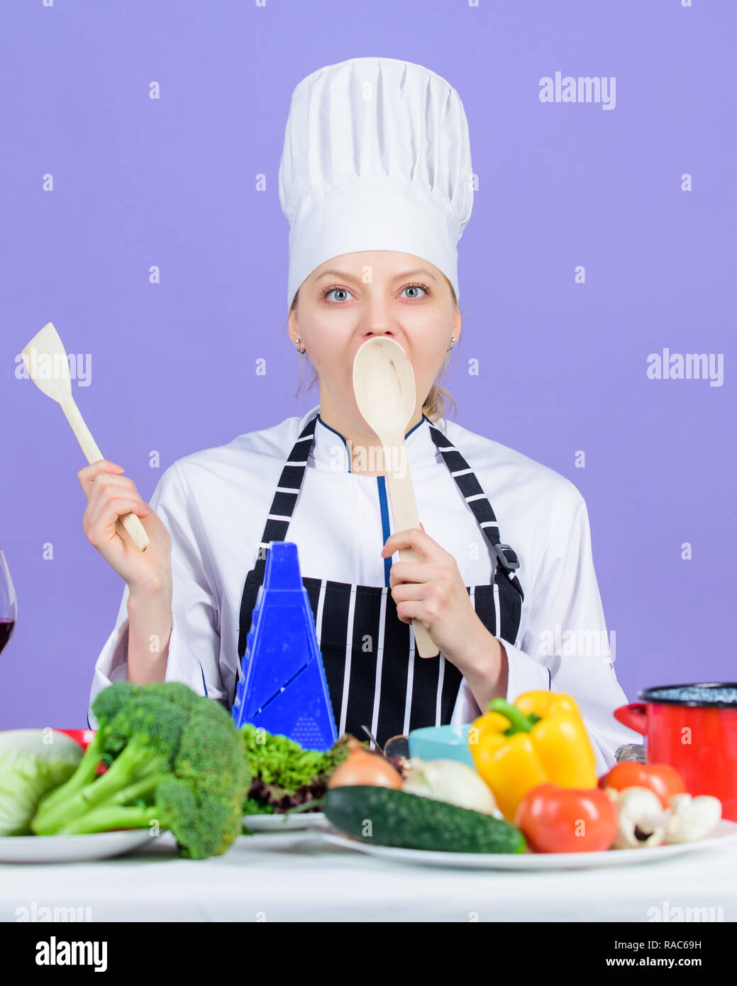 Cooking healthy food. Woman chef cooking healthy food. Fresh vegetables ...