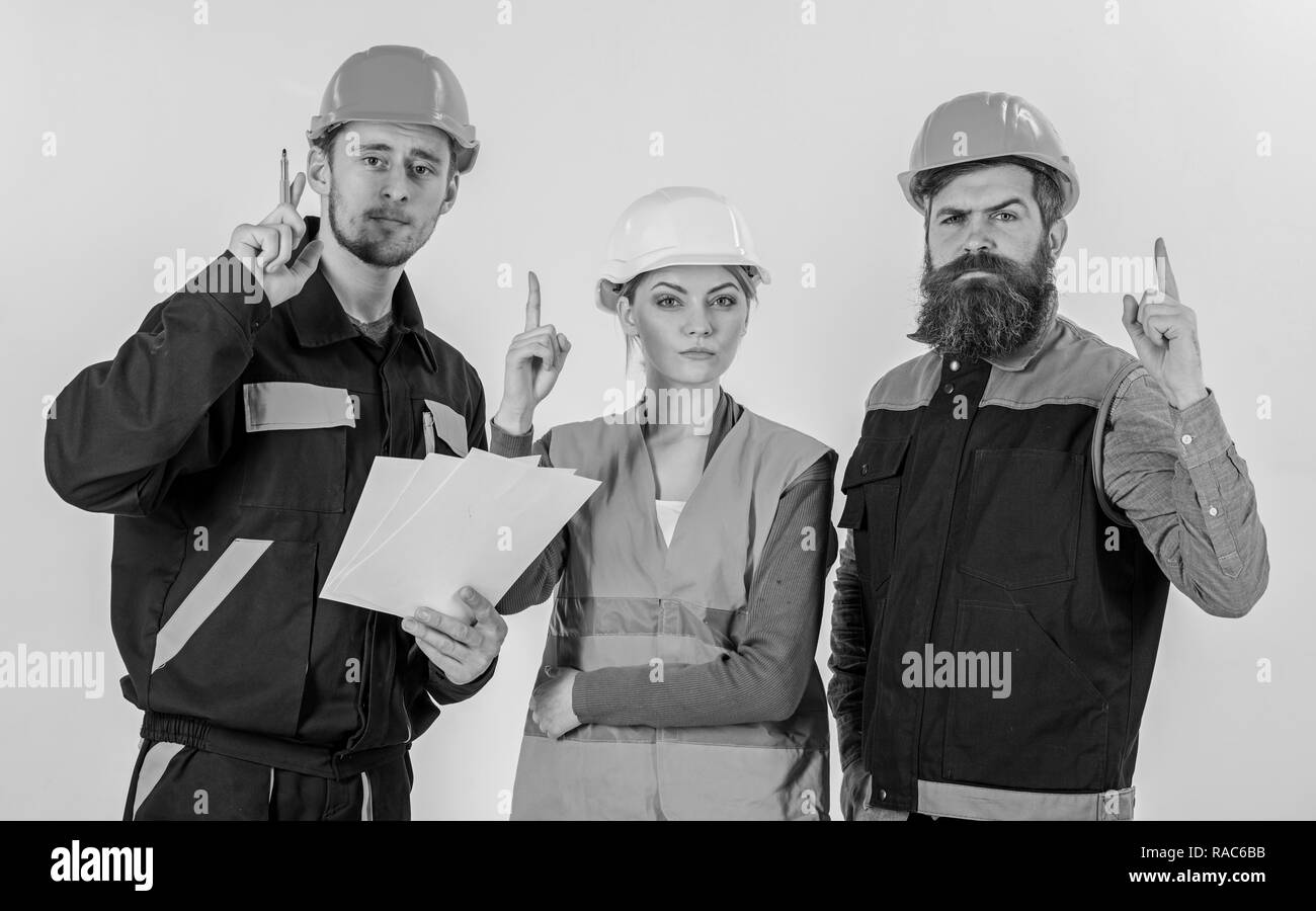 Builder and engineer found out how to solve problem. Men in hard hats ...