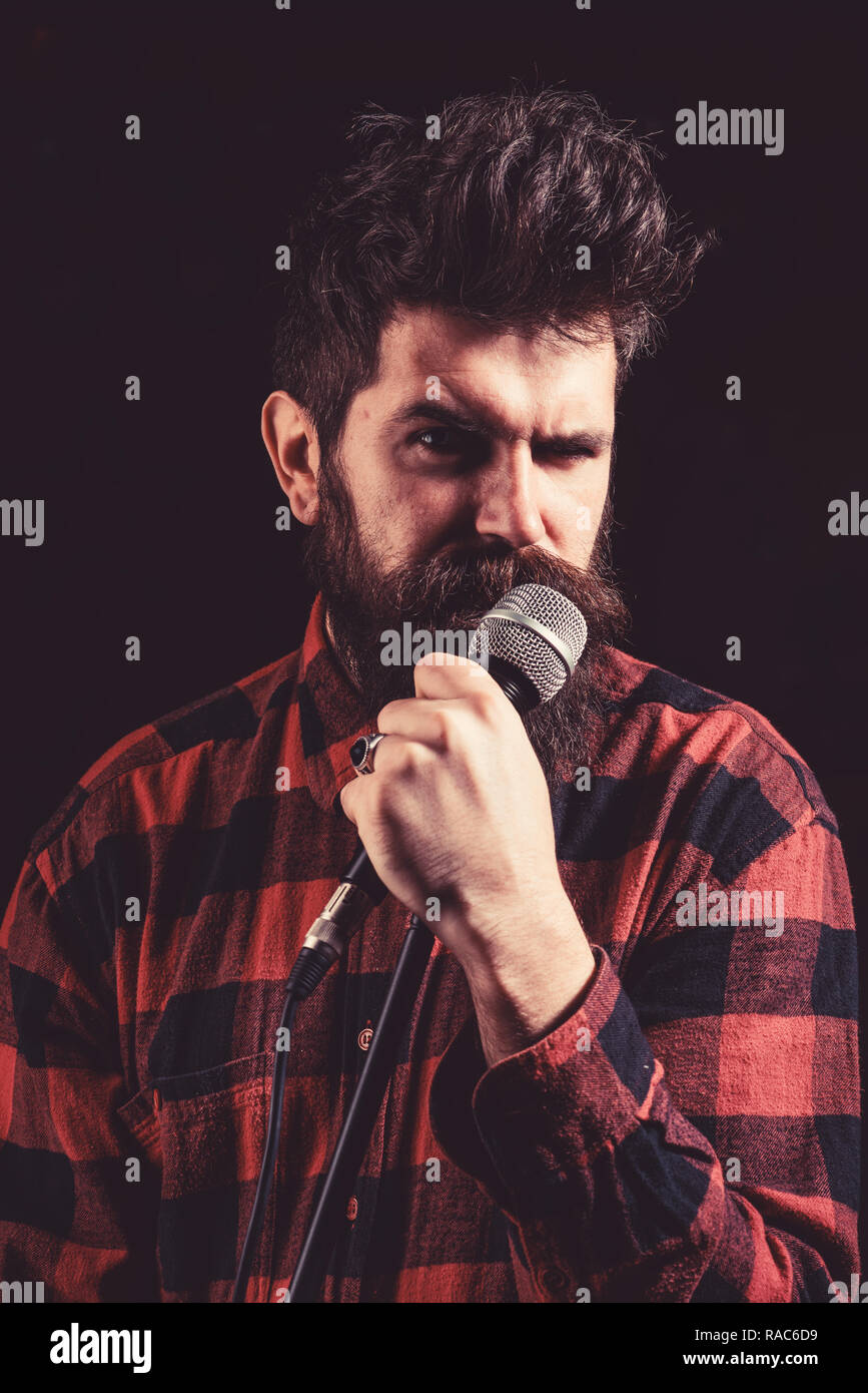 Musician, singer singing in music hall, club. Musician with beard and ...