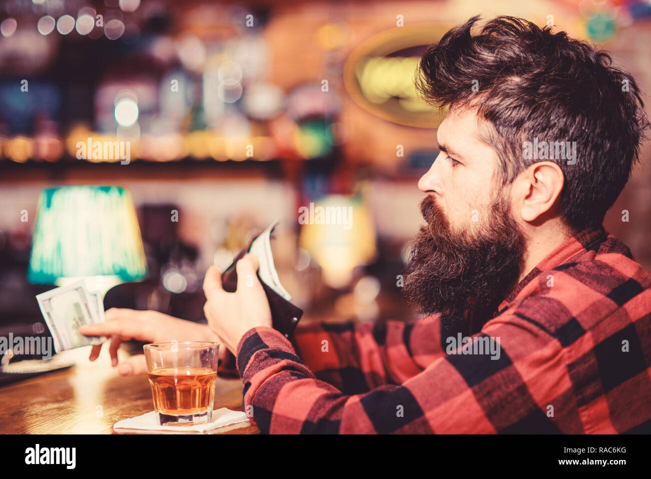 Depression and alcoholism concept. Guy spend leisure in bar, defocused ...