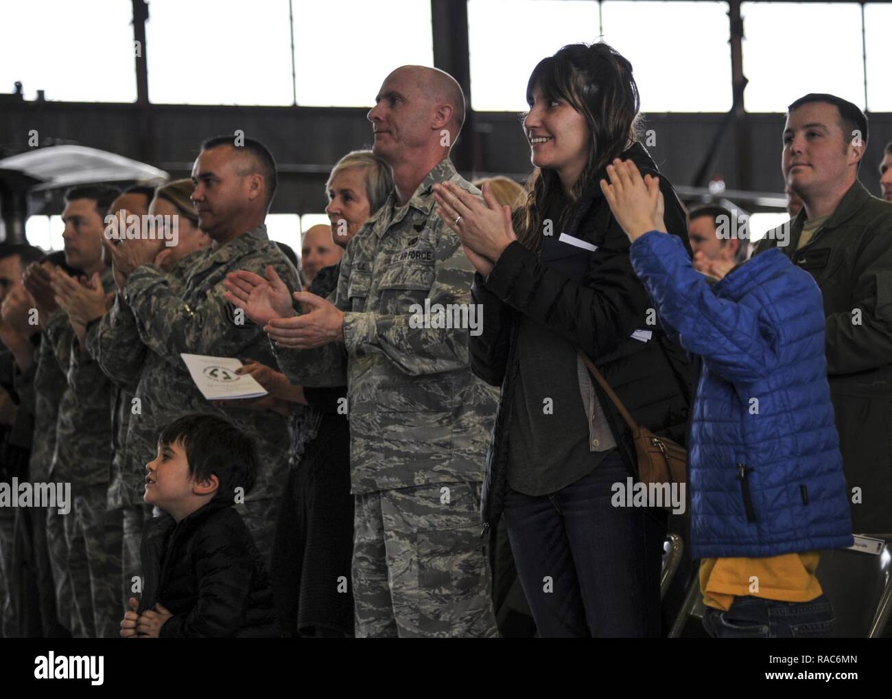 Family and Kirtland personnel applaud during the Distinguished Flying ...