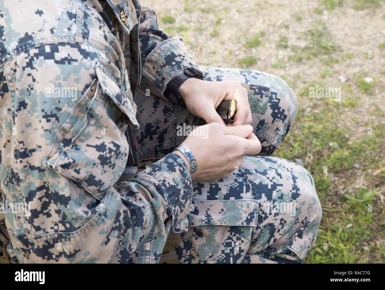 Marine loads ammunition magazine hi-res stock photography and images ...