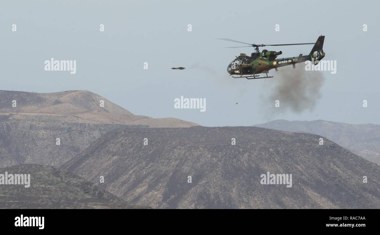 A French SA 342 Gazelle utility helicopter fires a live missile at ...