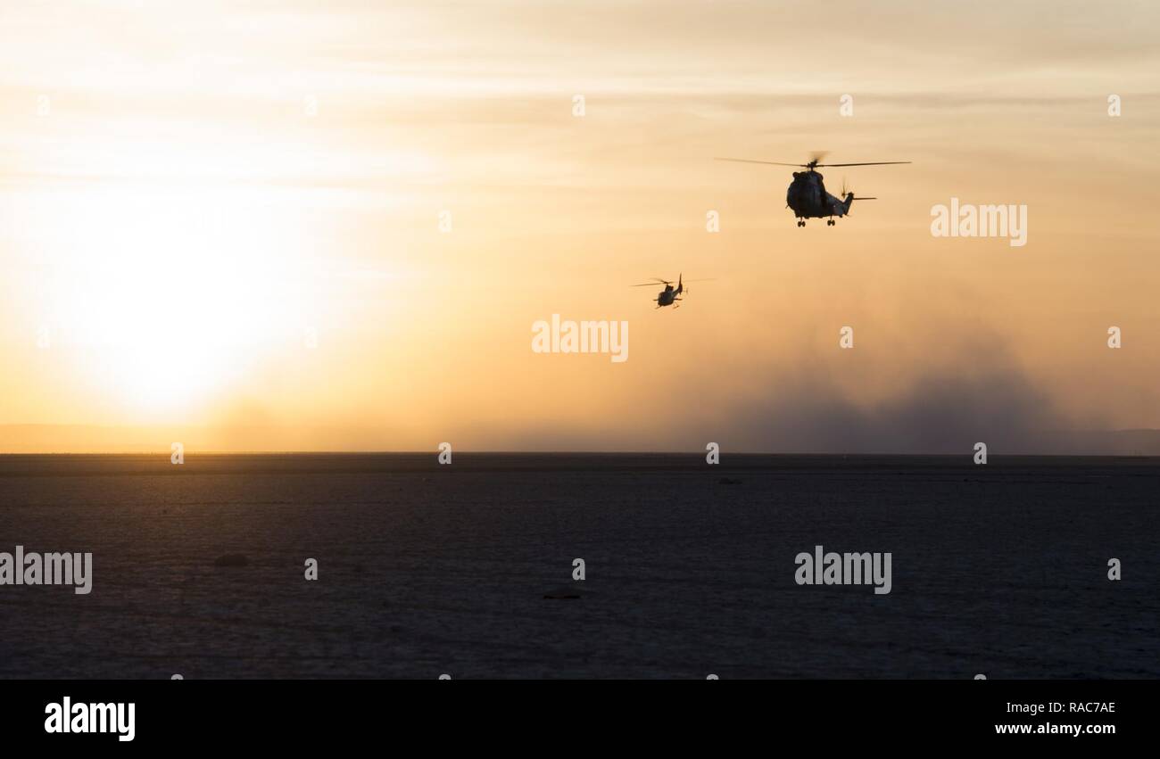 A French SA 330 Puma transport helicopter escorted by an SA 342 Gazelle ...