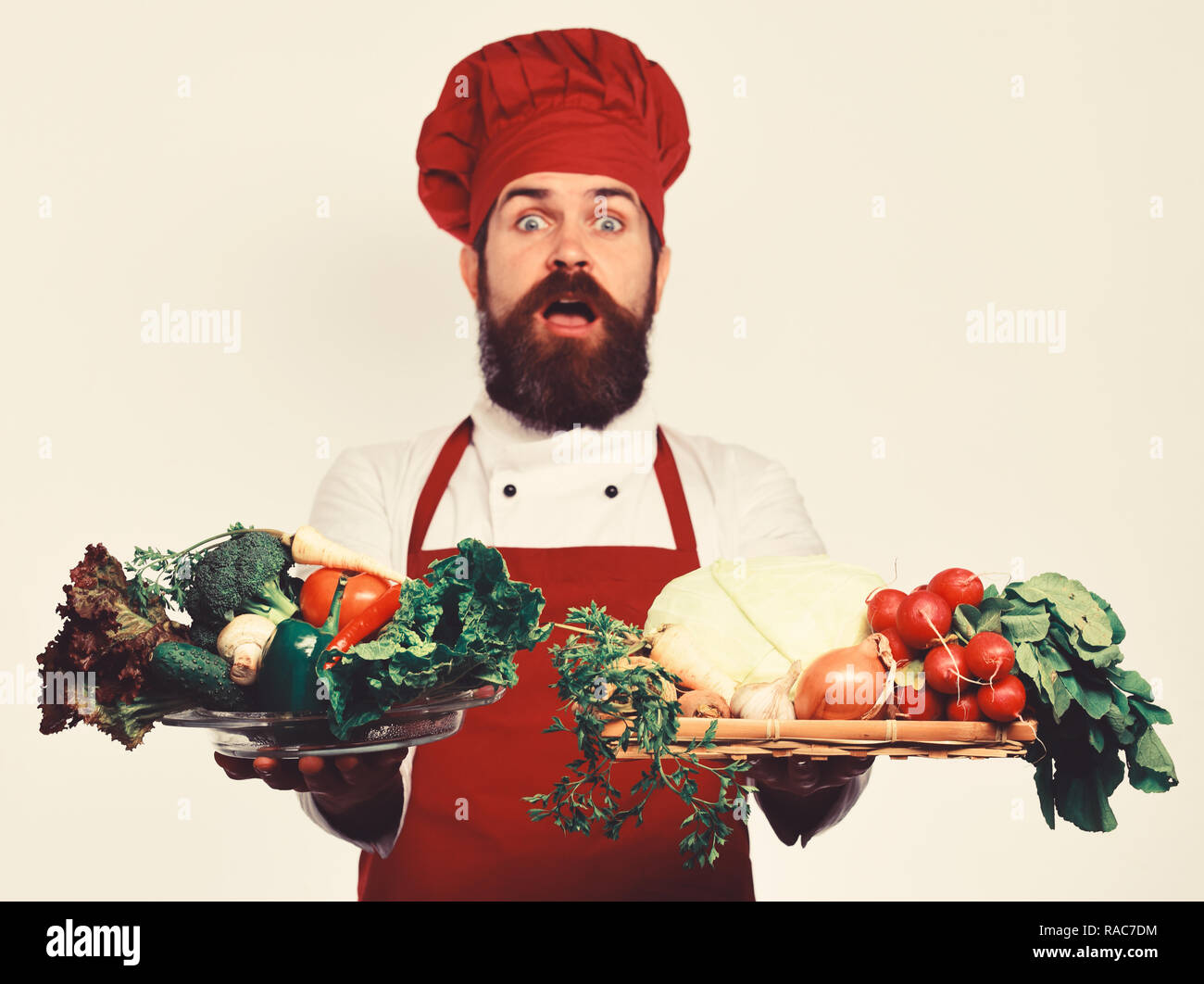 Man with beard on white background. Cook with surprised face in ...