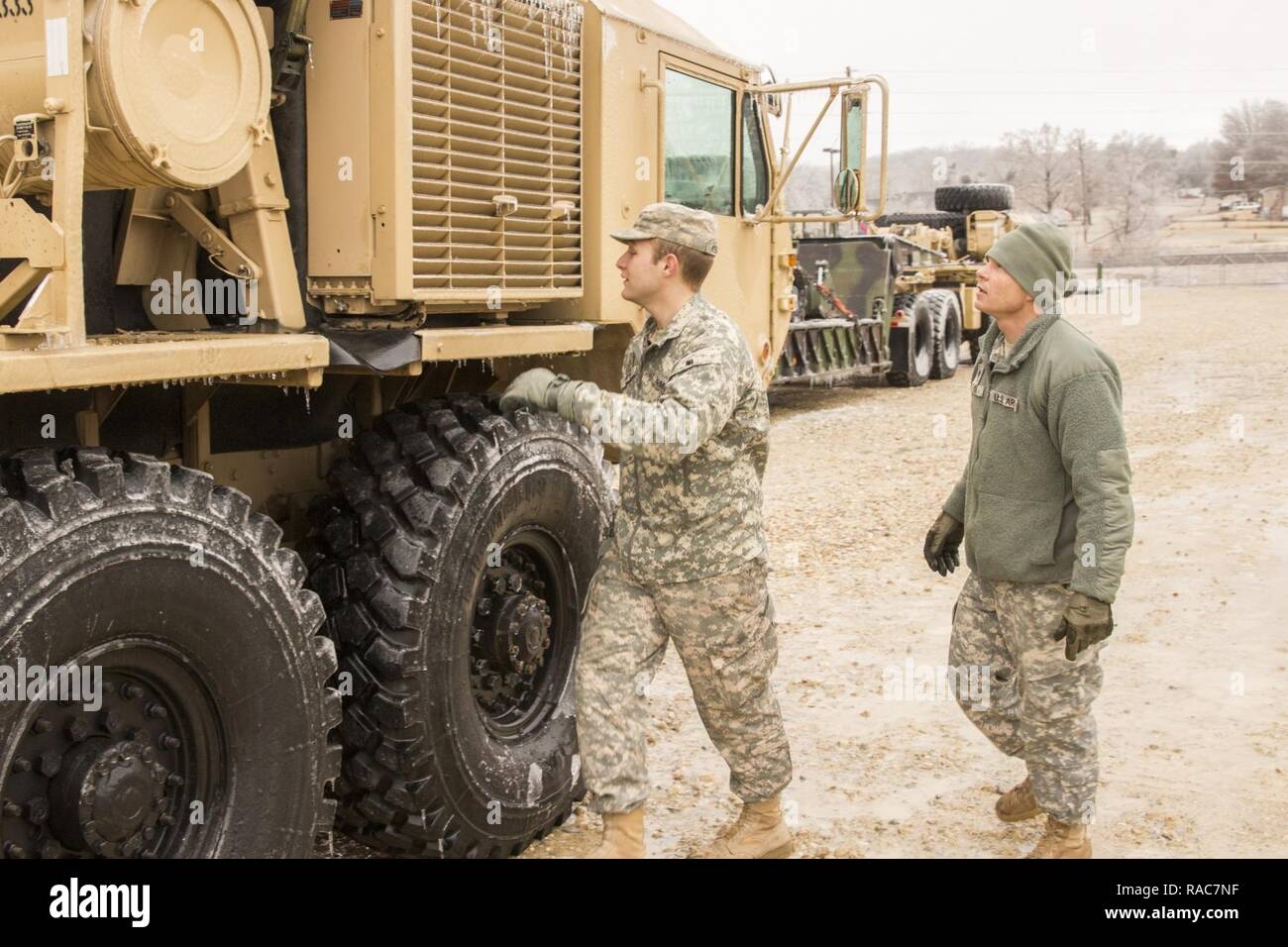 U.S. Army Spc. Cody Kemper and Osiris Nick, 220th Engineer Company ...
