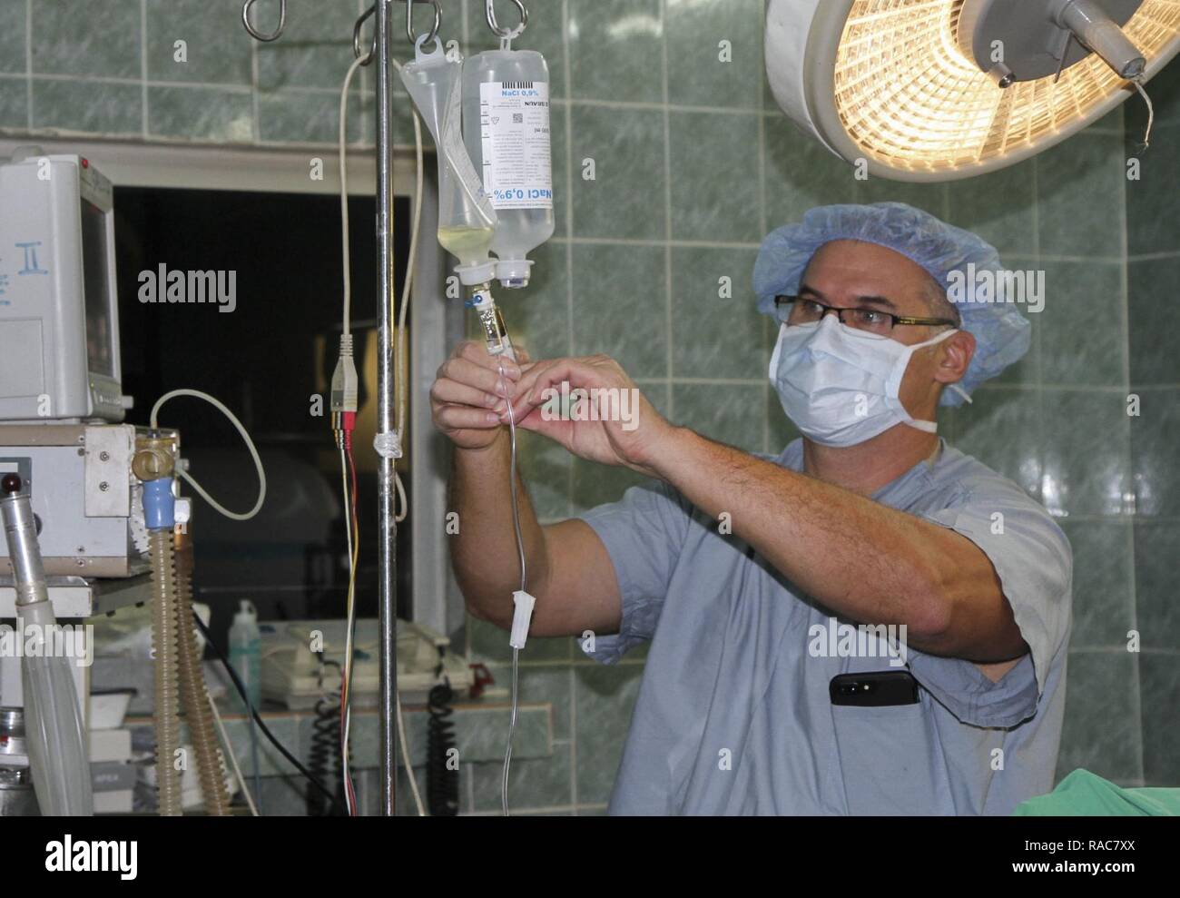 Nurse anesthetist Lt. Col. Edward Alexander, from the 332nd Medical ...