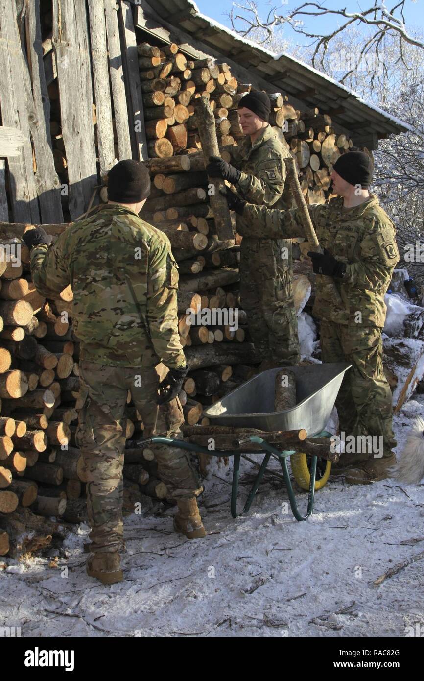 CAMP ADAZI, Latvia – Spc. Evan Kellogg [left], Sgt. Michael Chadwick ...
