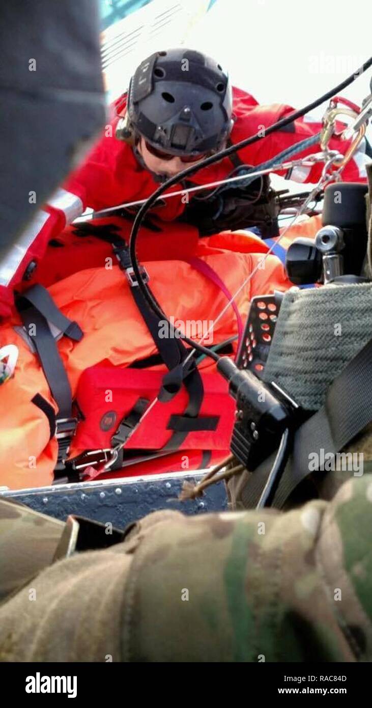 A Guardian Angel pararescueman from the 131st Rescue Squadron, guide a ...