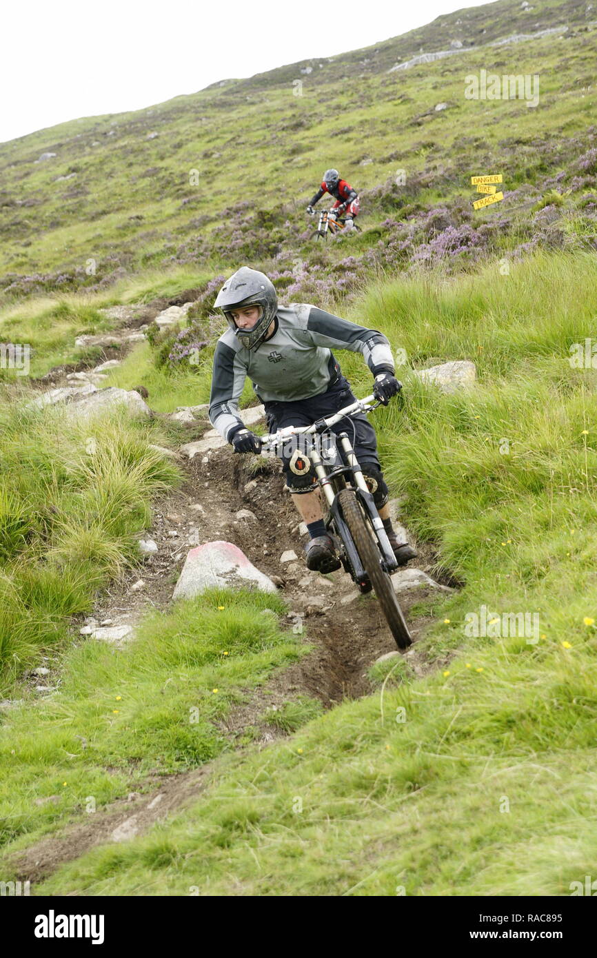Cyclists descending steep mountain hi-res stock photography and images ...