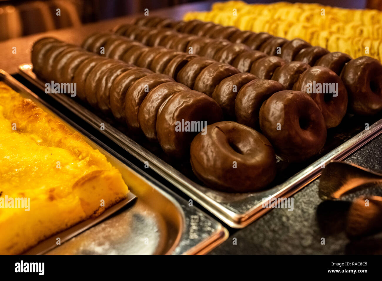 Buffet of donuts and pancakes for dessert in an unhealthy restaurant ...