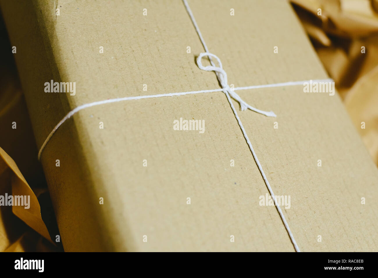 Gifts in simple cardboard boxes with white cord Stock Photo - Alamy
