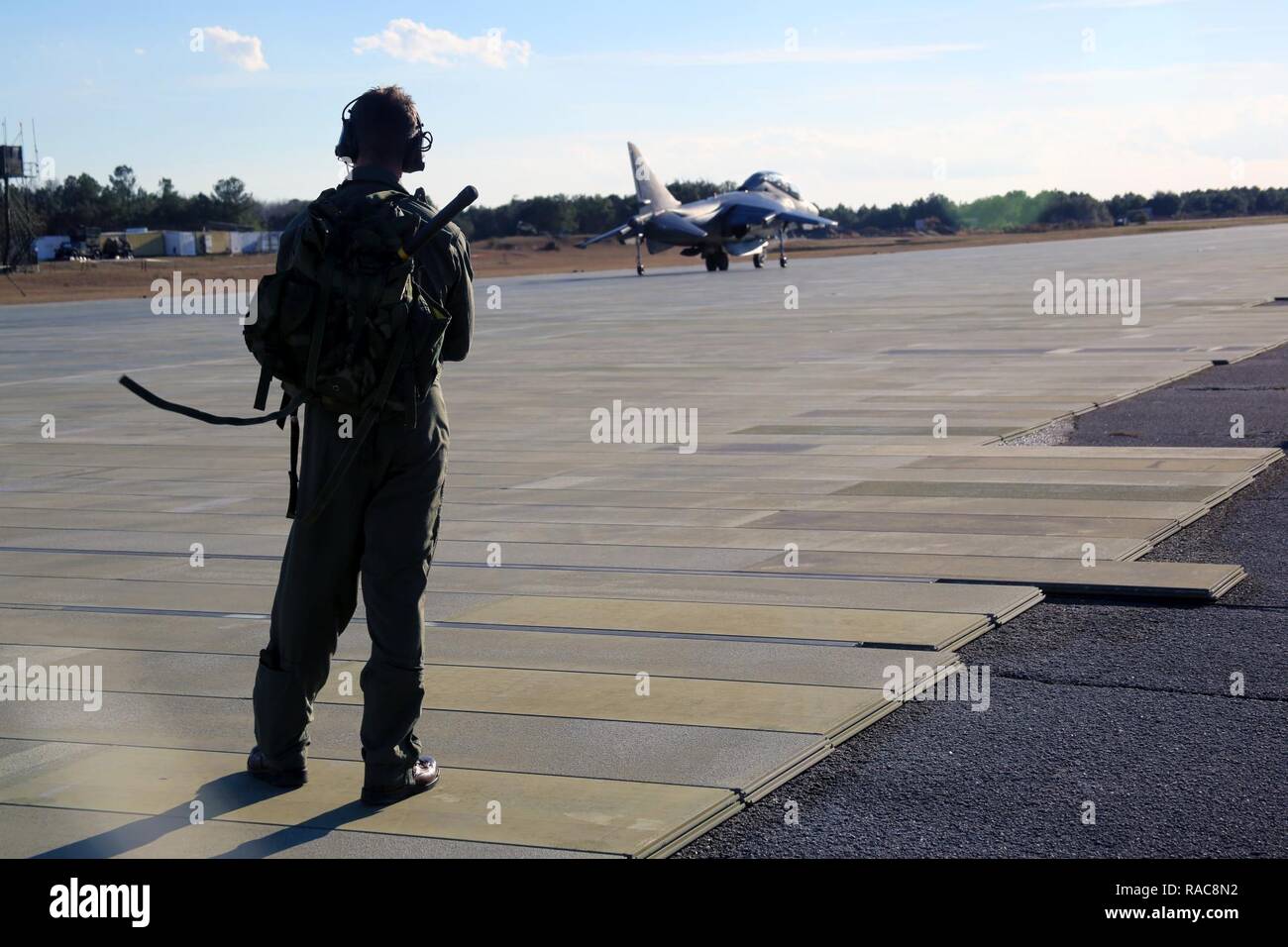 Maj. Aaron Hamblin observes an AV-8B Harrier as the training pilots ...