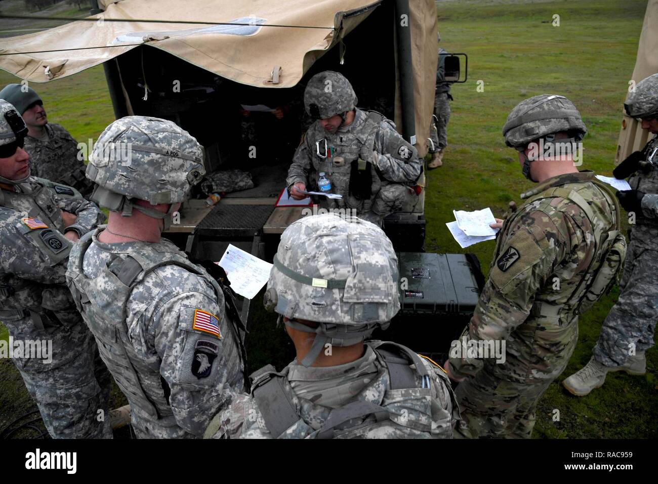 Army Soldiers assigned to Alpha and Bravo Battery, 1-143rd Field Artillery, receive a safety ...